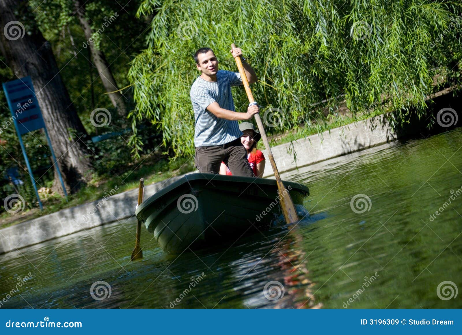 Couple paddling in rowboat stock image. Image of adults - 3196309