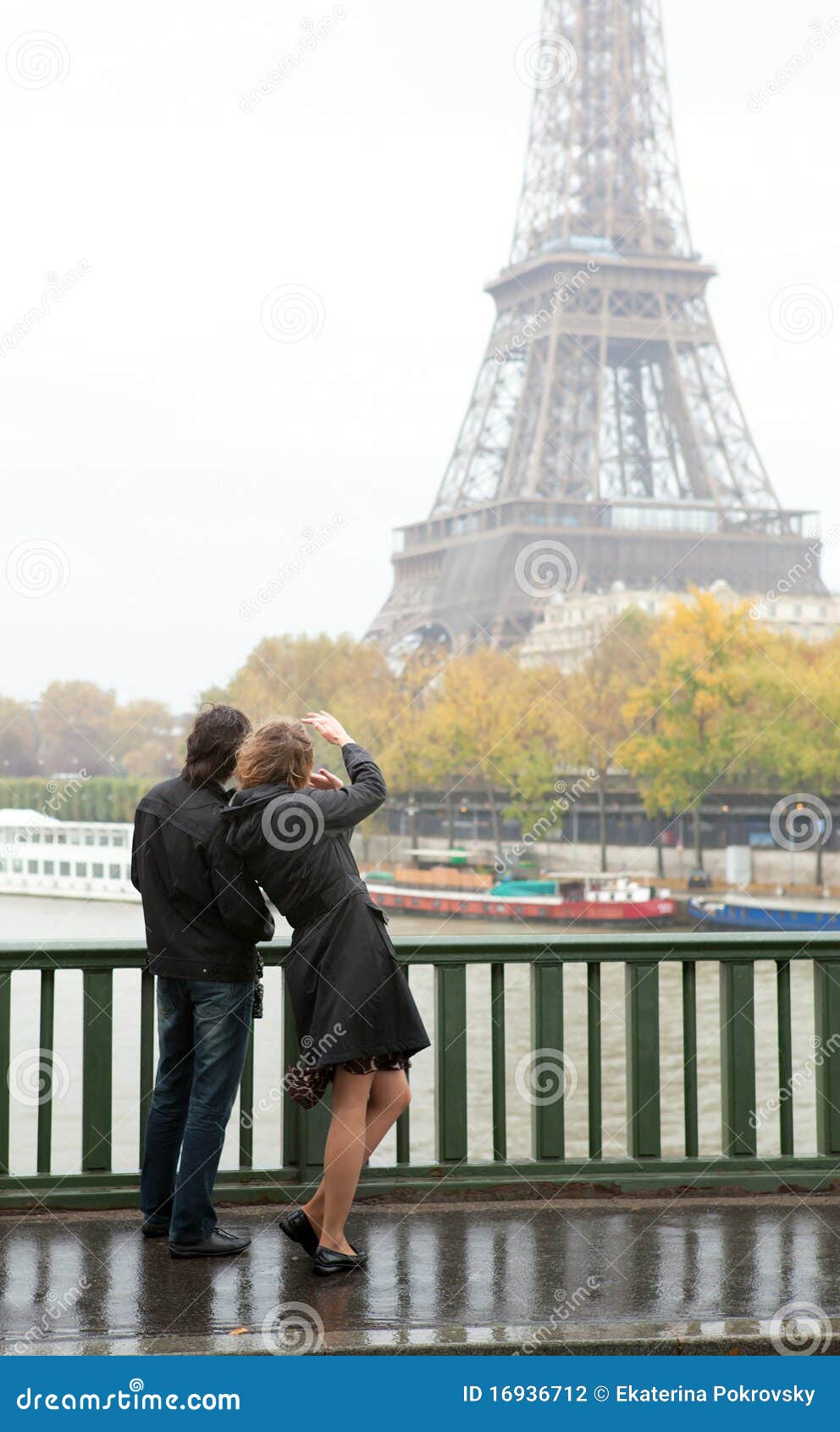 Couple in Paris at rain stock photo. Image of rain, landmark - 16936712