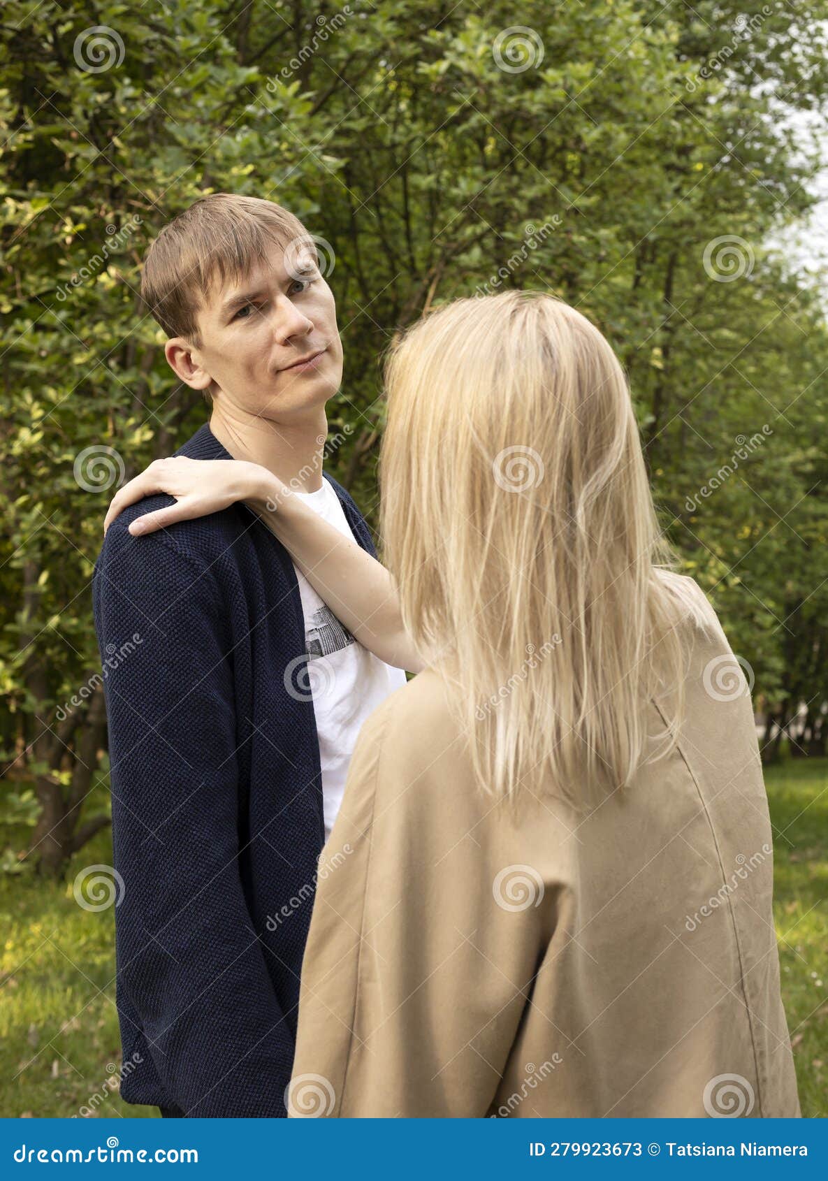 Couple in Park. Back View of Woman Holding Hand on Man& X27;s Shoulder ... Couple in Park. Back View of Woman Holding Hand on Man& X27;s Shoulder ...