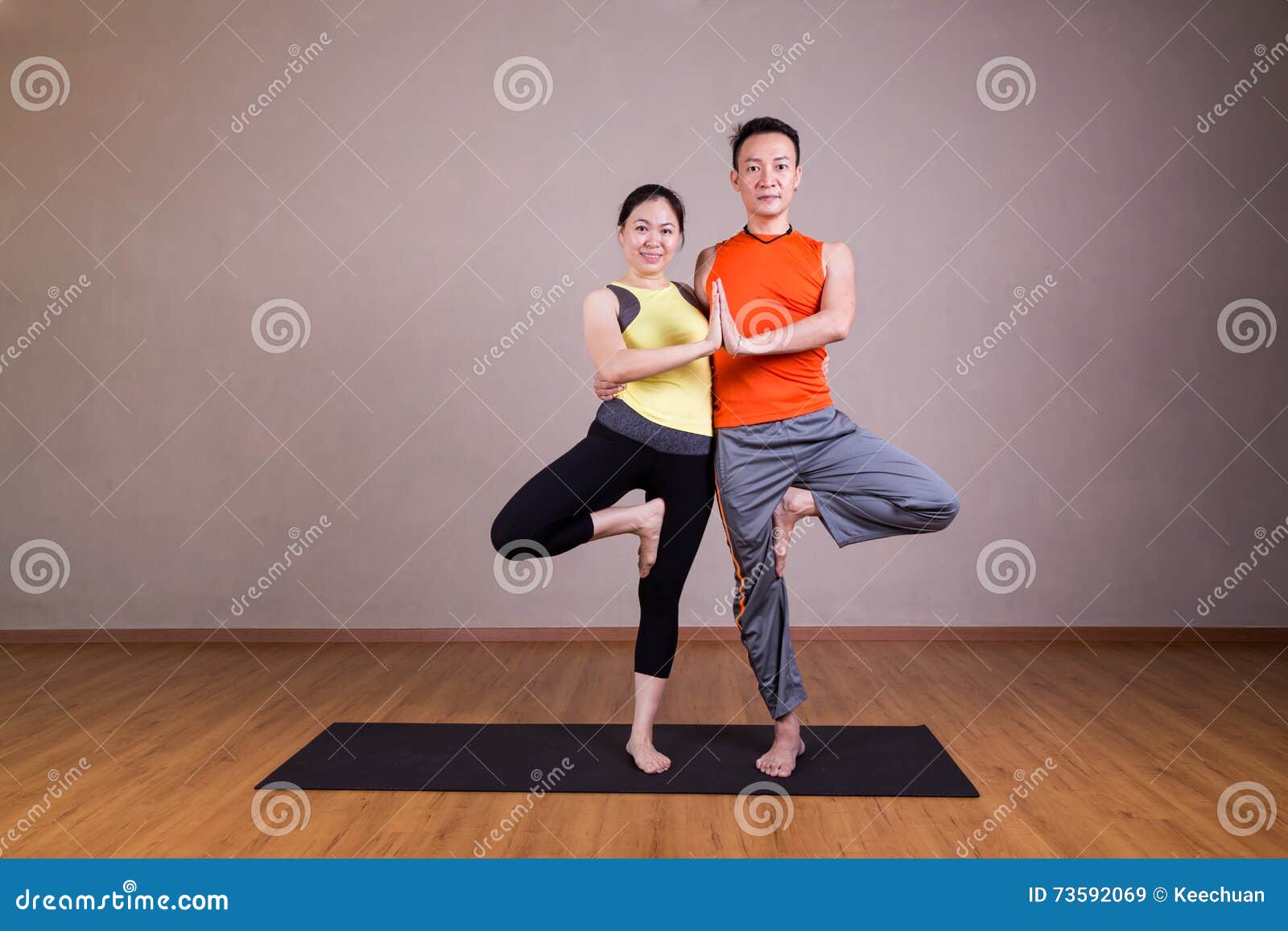 Couple Perform Double Tree Yoga Partner Pose Stock Image - Image of ...