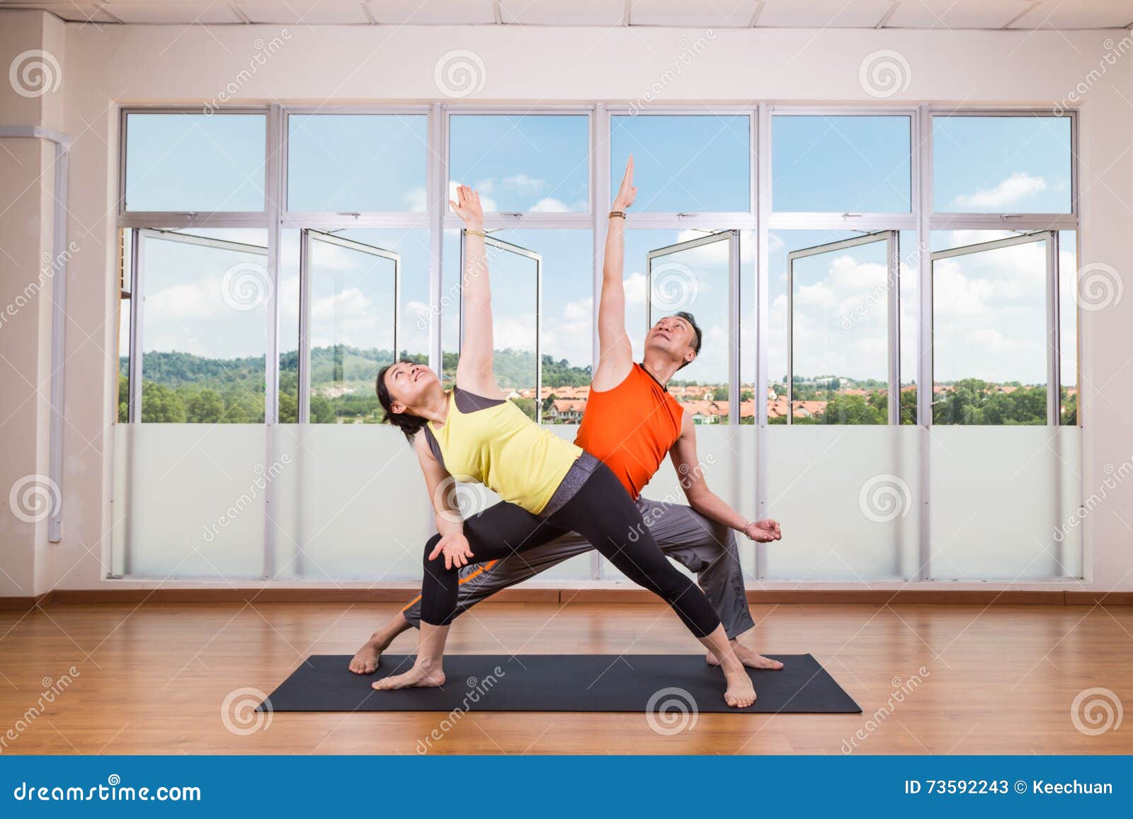 Couple Perform Series of Extended Side Angle Yoga Partner Pose Stock ...