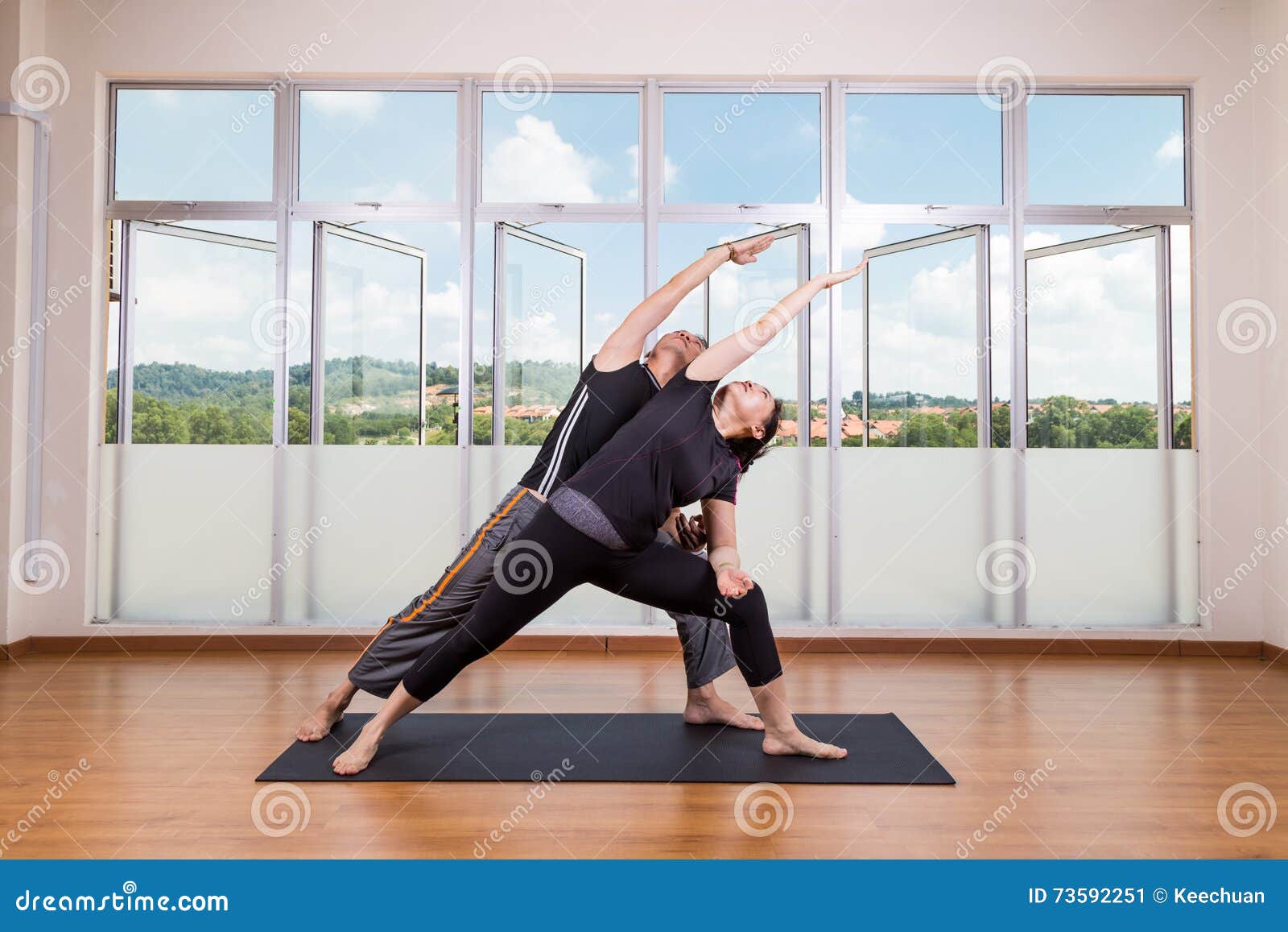 Yoga With Partner, Seated And Standing Forward Bend Stock Photography ...