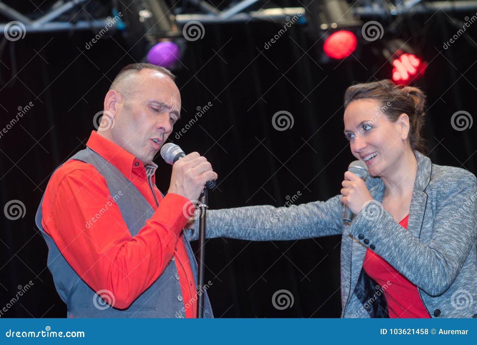 Couple performing on stage stock photo. Image of concert - 103621458