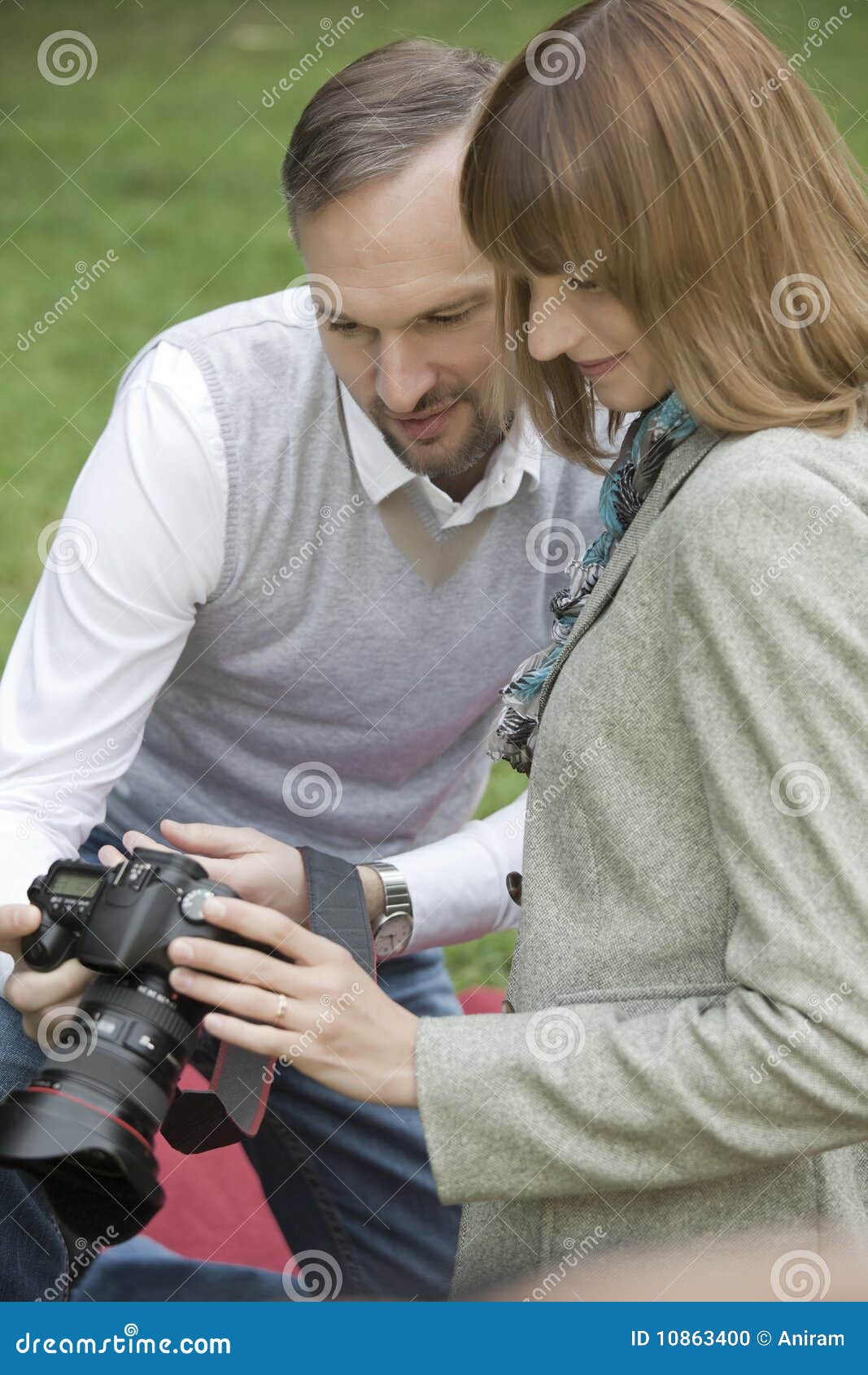 Couple with photo camera stock photo. Image of camera - 10863400