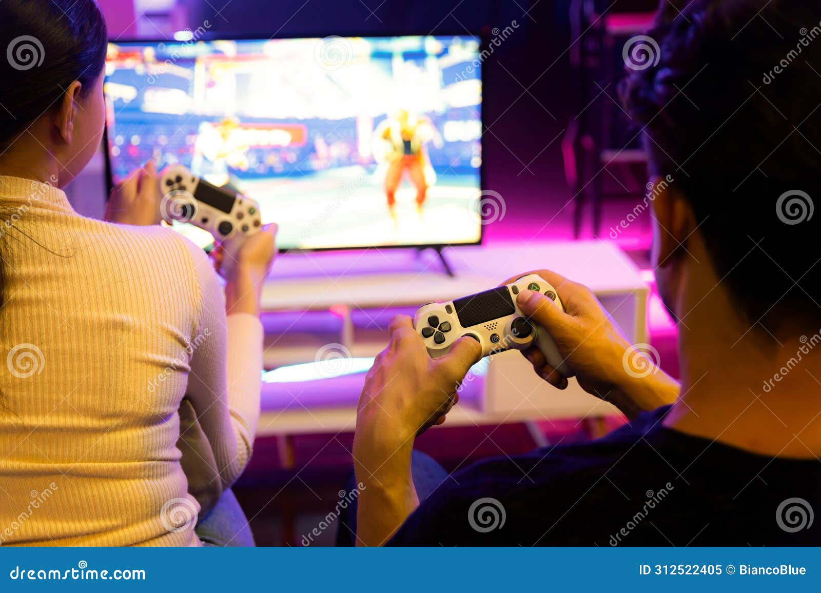 Couple Player Video Game Using Joysticks at Back Side. Postulate. Stock ...