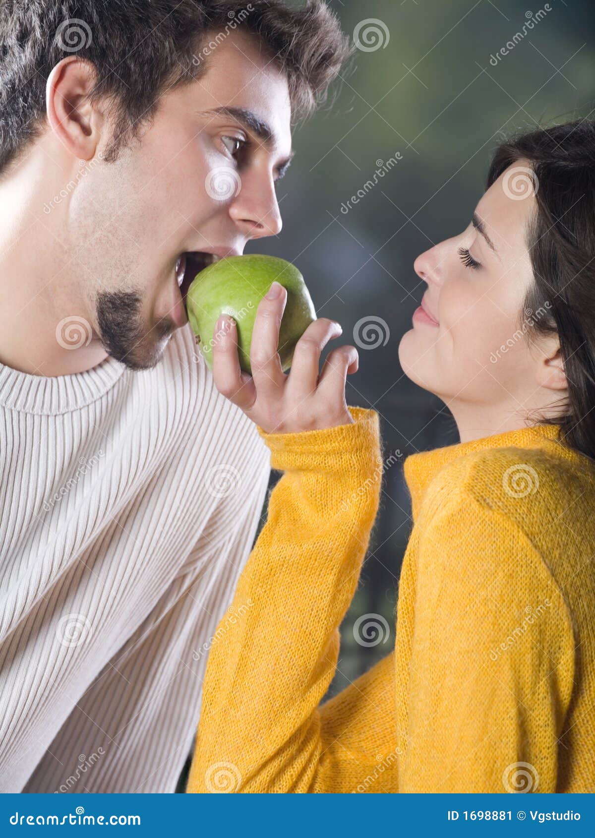 Couple Playfully Eating Apple Stock Image - Image of lifestyle, people ...