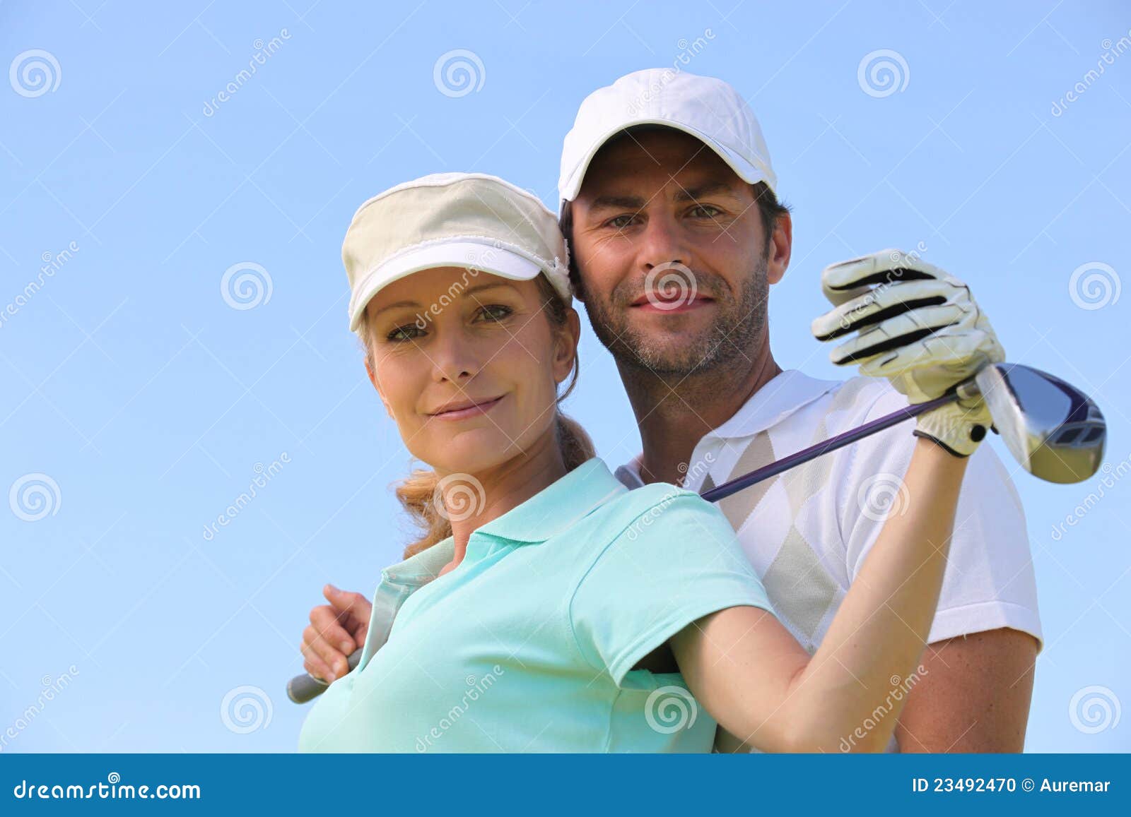 Couple playing golf stock photo. Image of boyfriend, club - 23492470