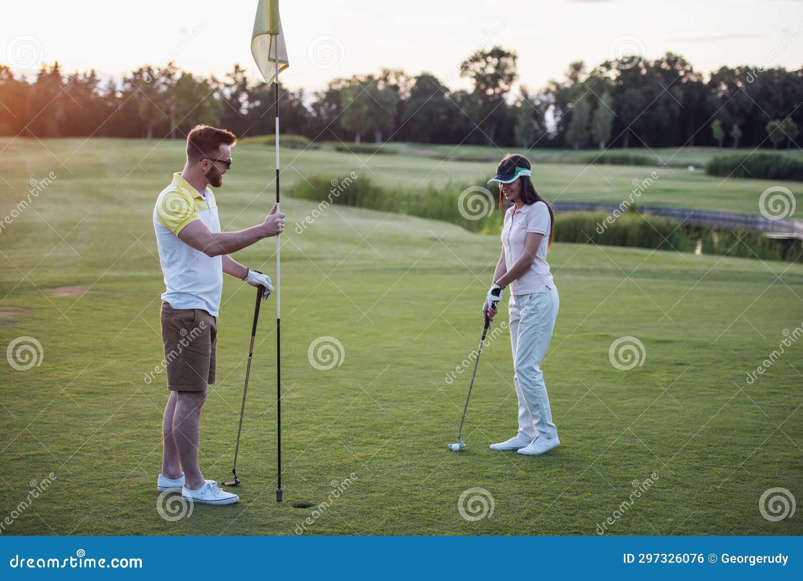 Couple playing golf stock photo. Image of club, beautiful - 297326076
