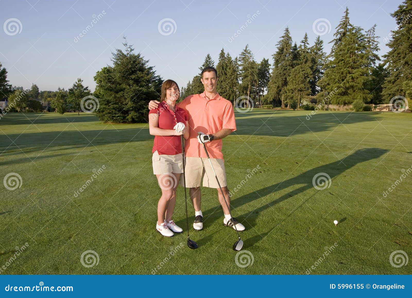 Couple Playing Golf on Course - Horizontal Stock Image - Image of ...