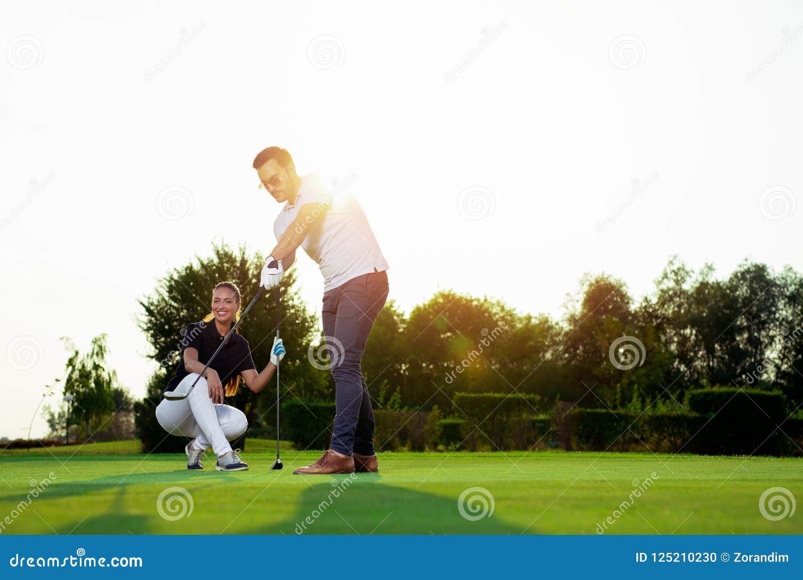 Couple Playing Golf Together on Golf Course Stock Photo - Image of ...