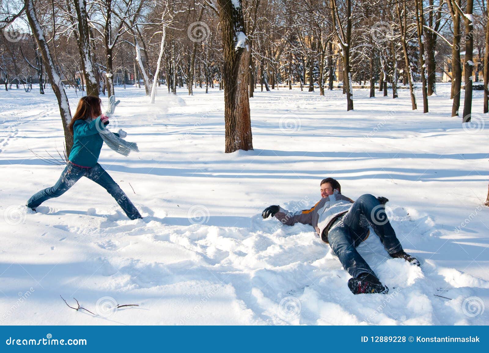 Couple playing in the park stock photo. Image of snow - 12889228