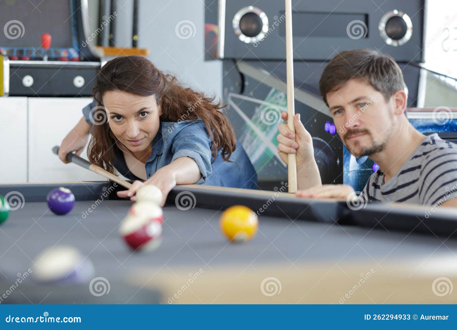 Couple Playing Pool with Woman Taking Aim Stock Image - Image of active, center: 262294933