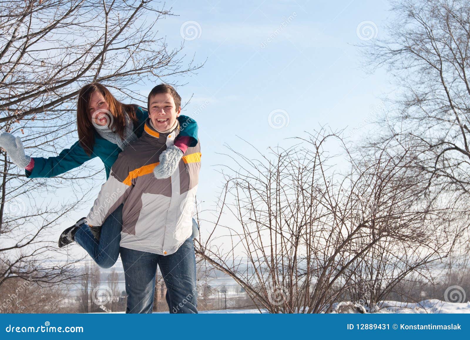 Couple playing in snow stock image. Image of jumping - 12889431