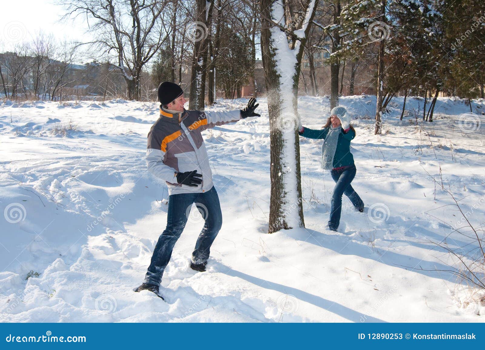 Couple playing with snow stock image. Image of happiness - 12890253
