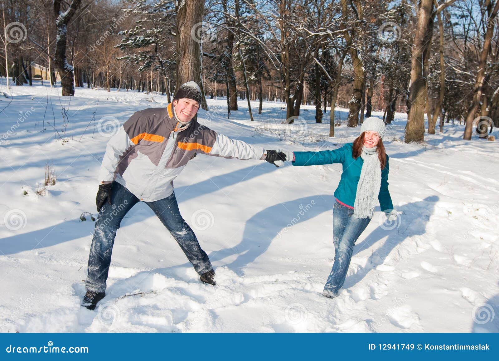 Couple playing in snow stock image. Image of season, family - 12941749