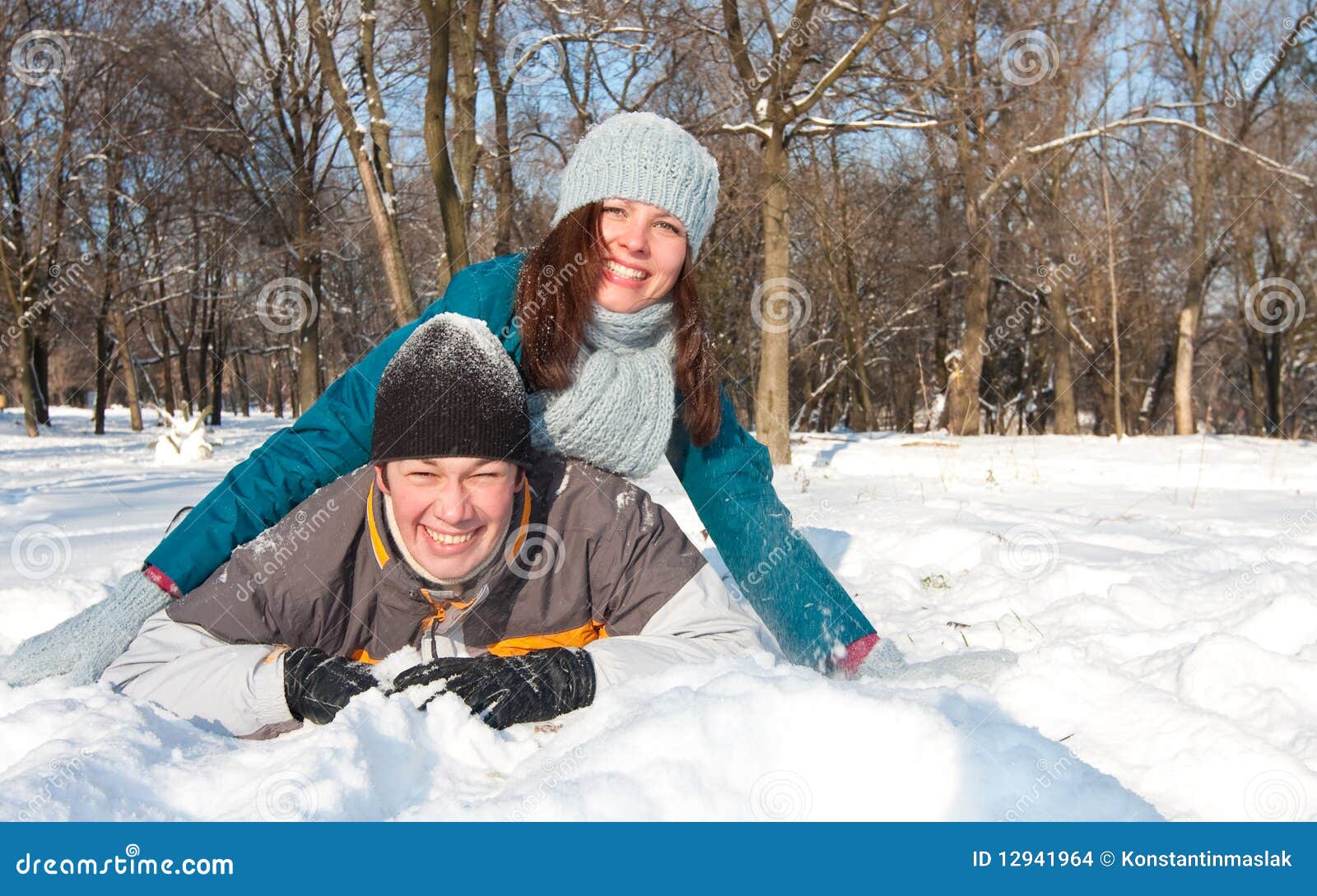 Couple playing in snow stock photo. Image of adult, lifestyles - 12941964