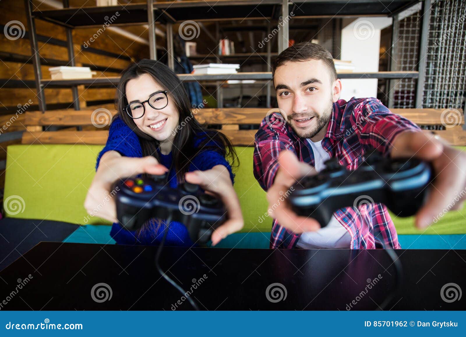 Couple playing video games stock photo. Image of controller - 85701962