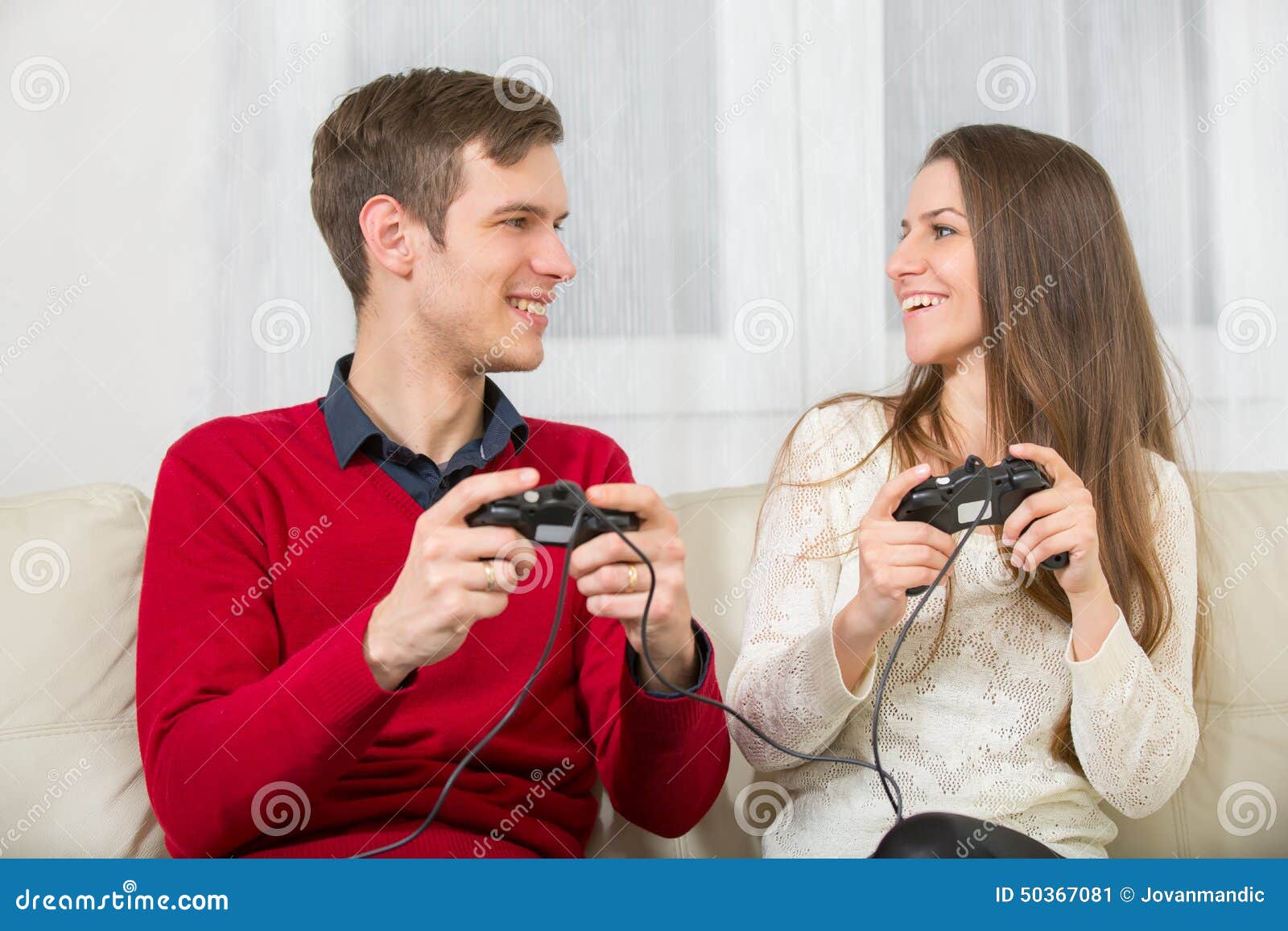 Couple playing video games stock image. Image of domestic - 50367081