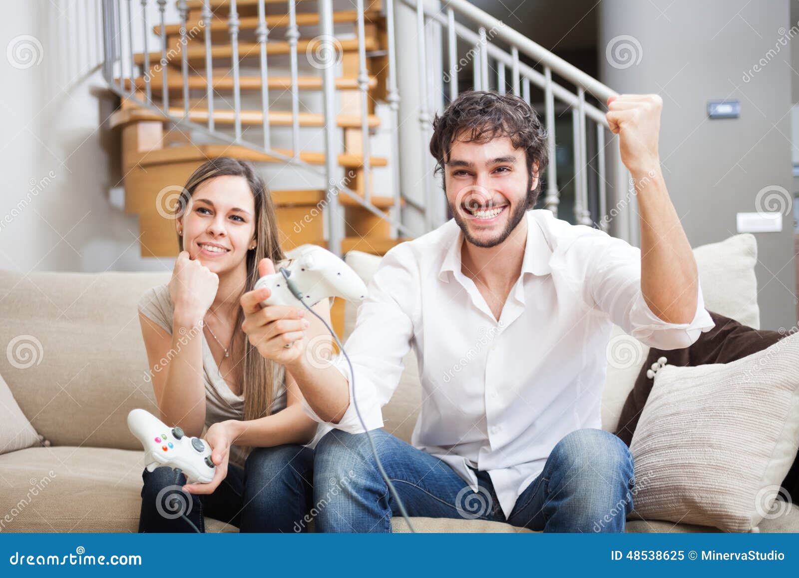 Couple playing video games stock image. Image of interior - 48538625