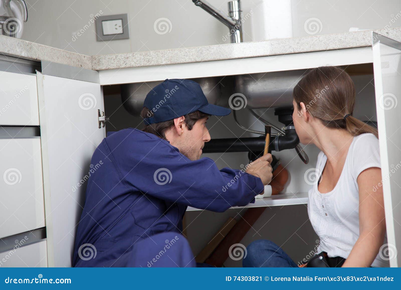 Couple Plumbers Fixing the Pipes Stock Image - Image of handyman ...