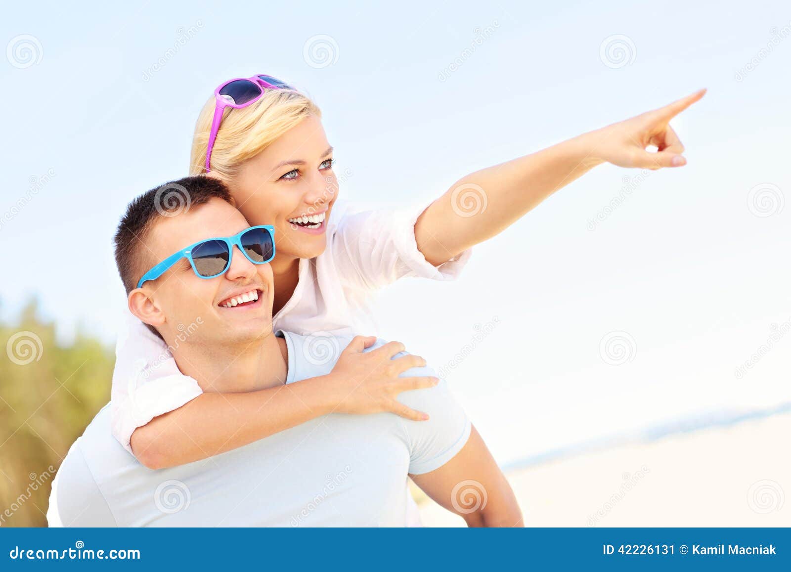 Couple Pointing at the Beach Stock Image - Image of love, showing: 42226131