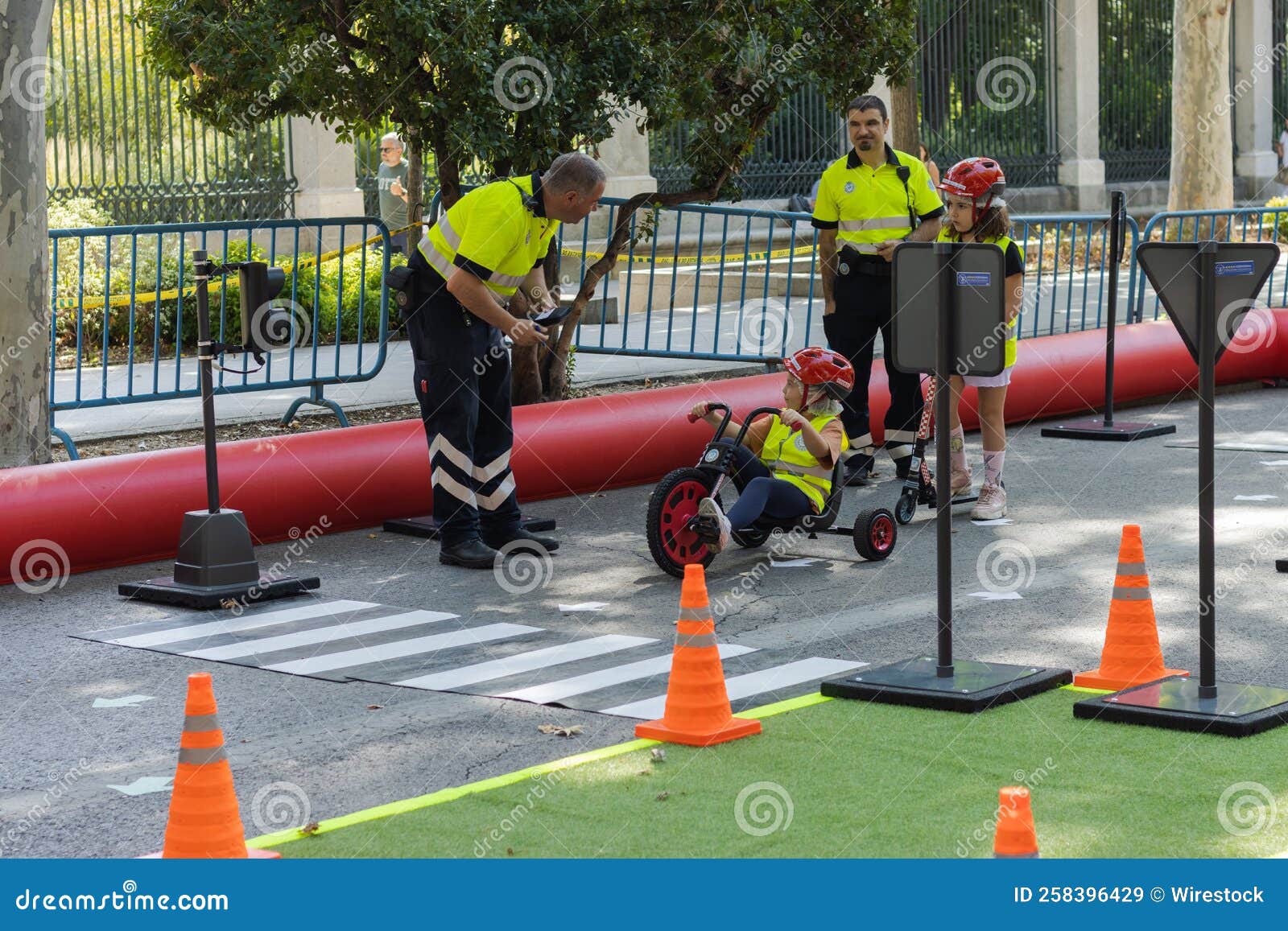 Couple of Police and Traffic Enforcers Teaching Children the Basic ...