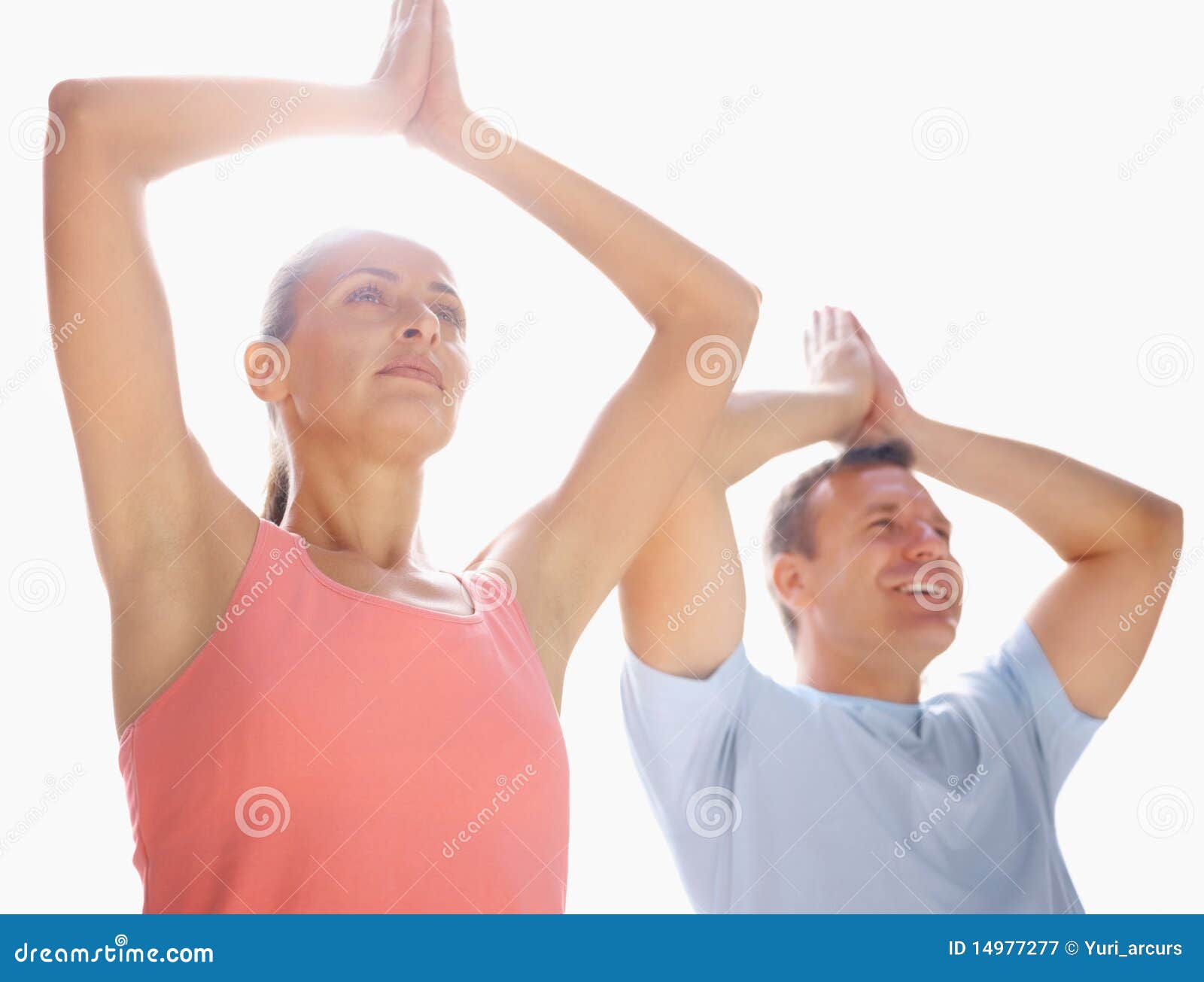 Couple Practicing Yoga Together with Hands Joined Stock Image - Image ...