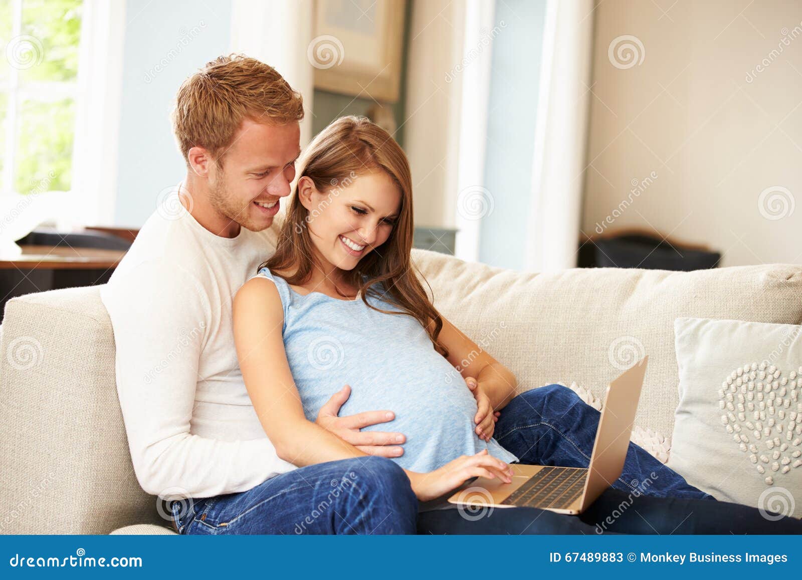 Couple with Pregnant Woman Using Laptop Computer Together Stock Image ...