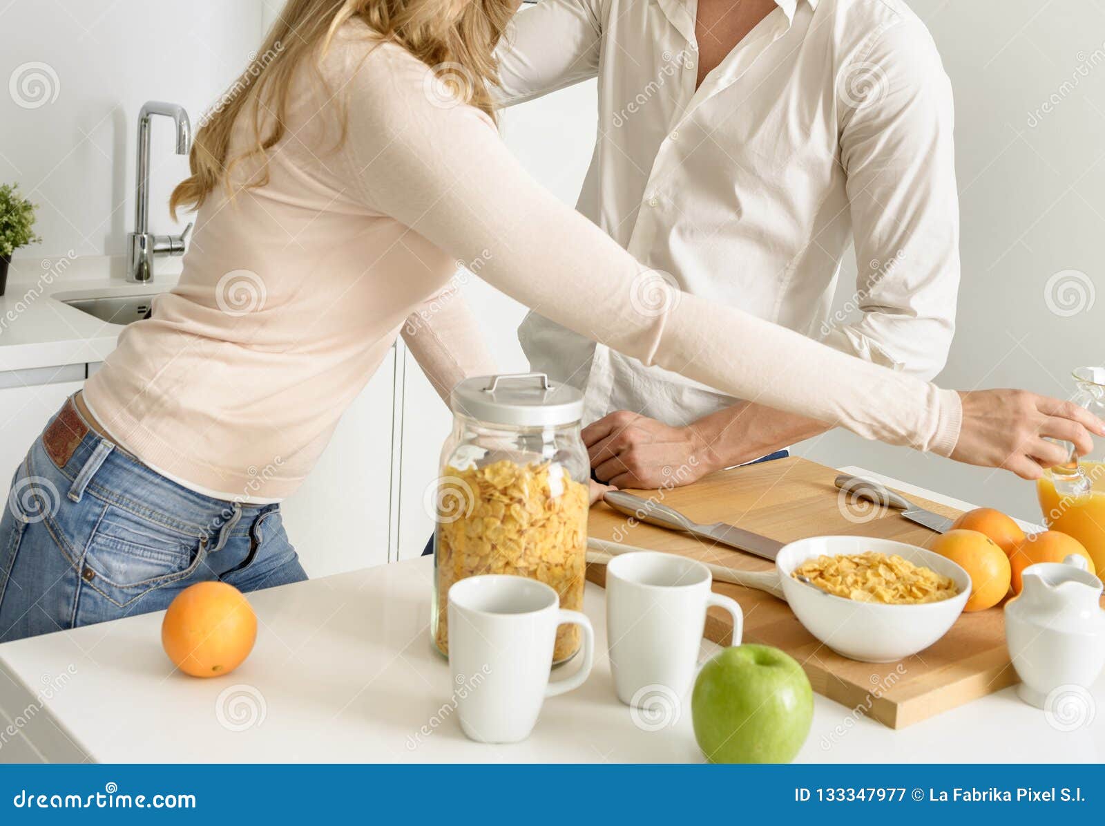 Couple preparing breakfast stock image. Image of cereal - 133347977