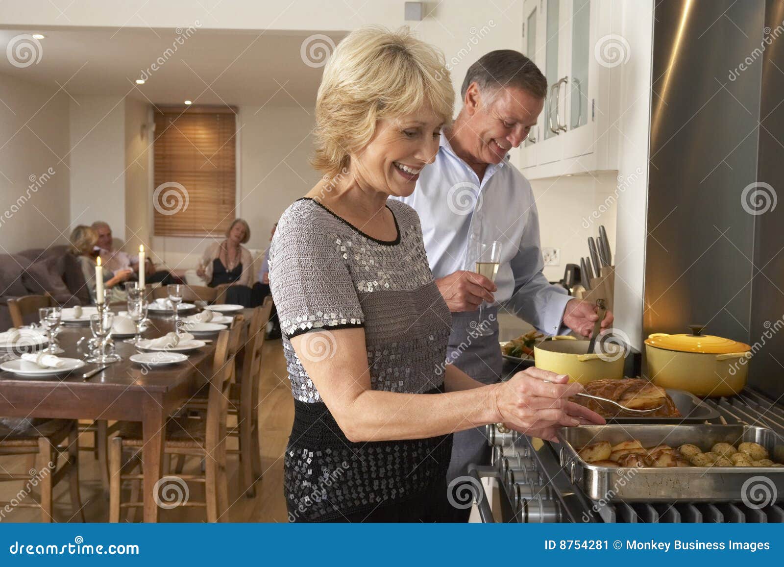 Couple Preparing Food for a Dinner Party Stock Image - Image of indoors ...