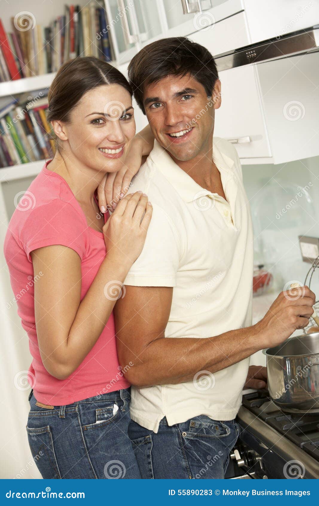 Couple Preparing Meal at Cooker Stock Image - Image of indoors, meal ...