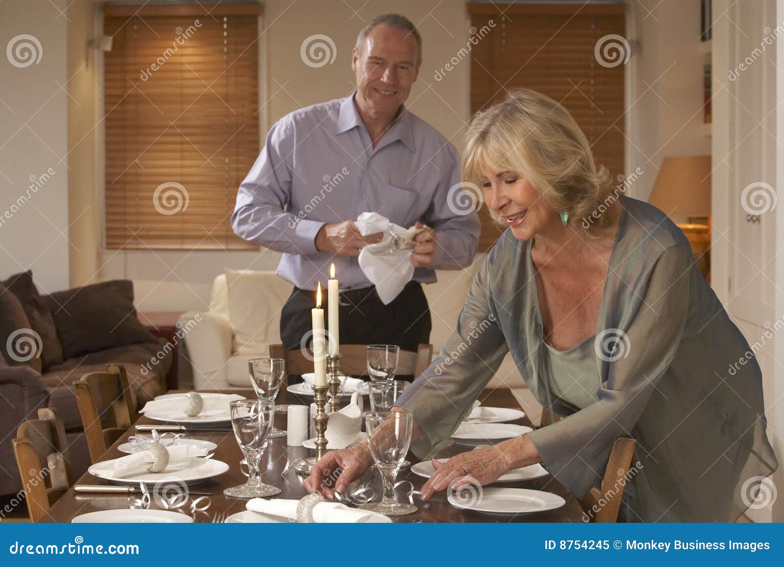 Couple Preparing Table for a Dinner Party Stock Image - Image of ...