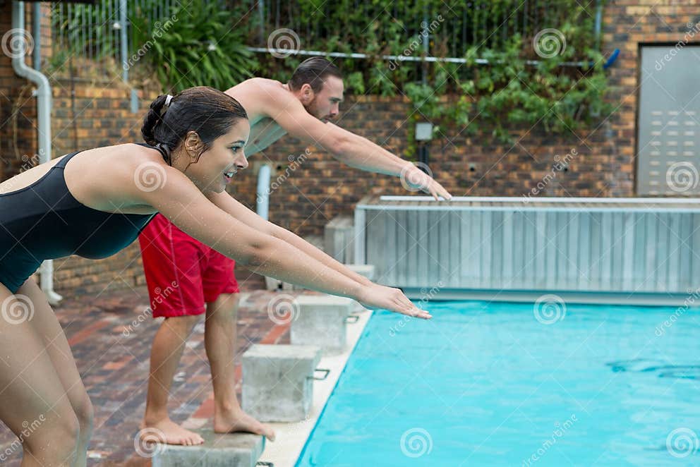 Couple Preparing To Dive in Pool Stock Image - Image of fitness, love ...