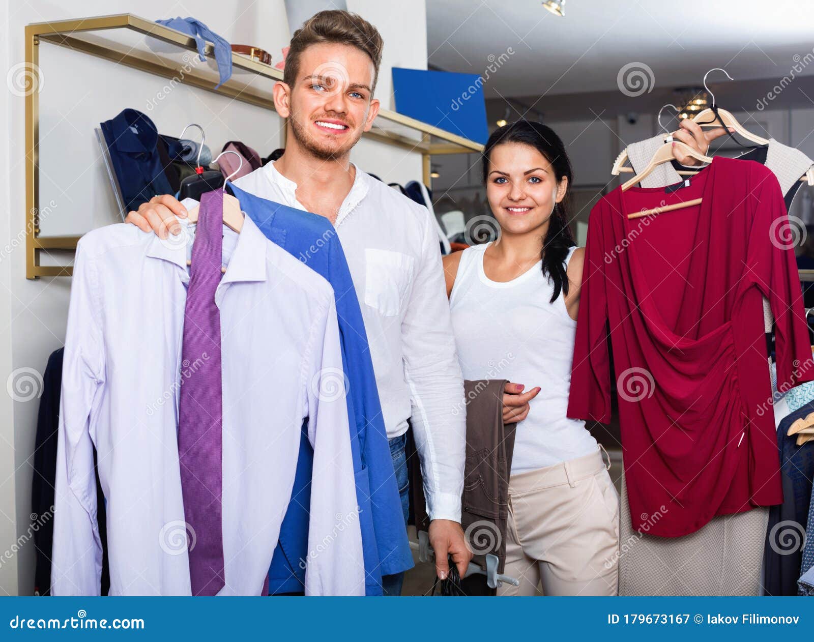 Couple Purchasing Clothes for Two in Boutique Stock Image - Image of ...