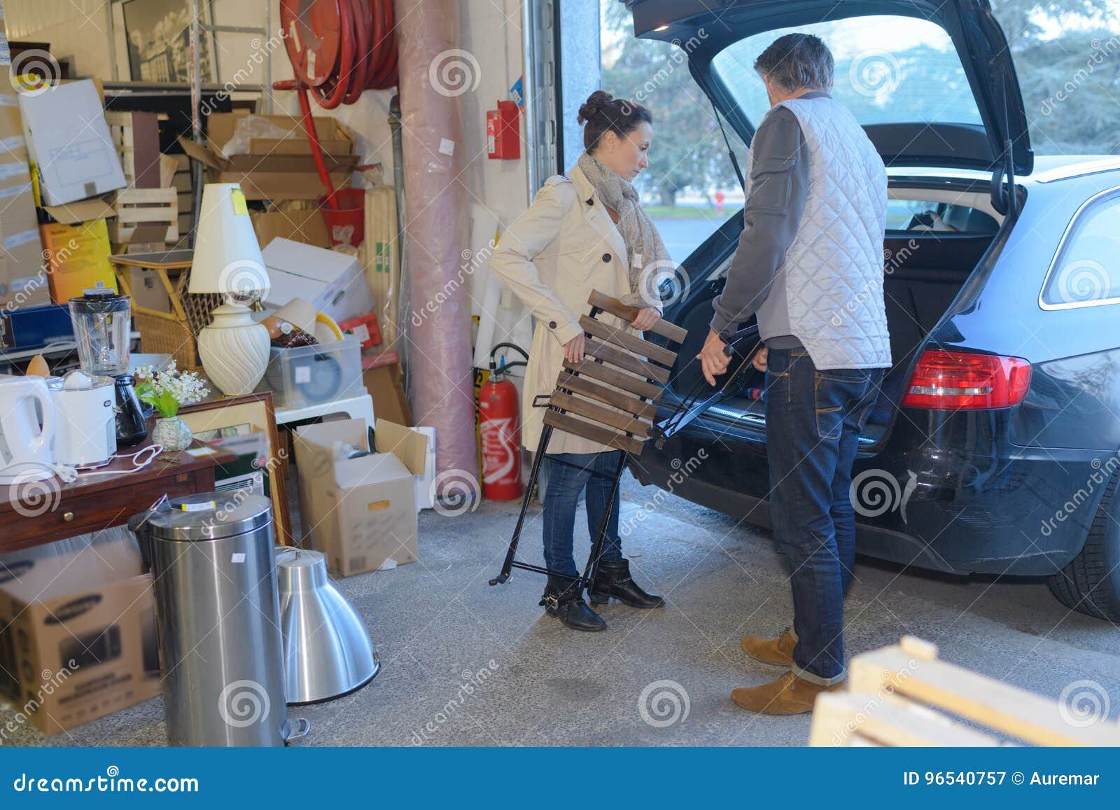 Couple Putting Items in Car To Dump at Landfill Stock Image - Image of ...