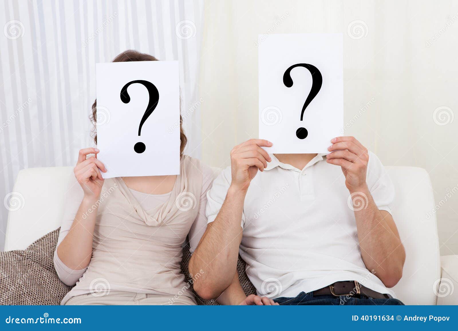 Couple with question marks stock photo. Image of couch - 40191634