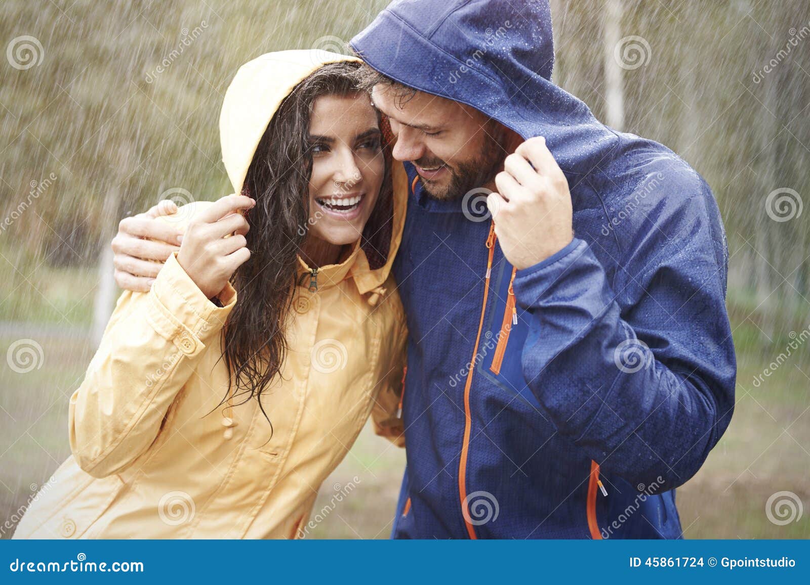Couple during rainy day stock photo. Image of hiding - 45861724