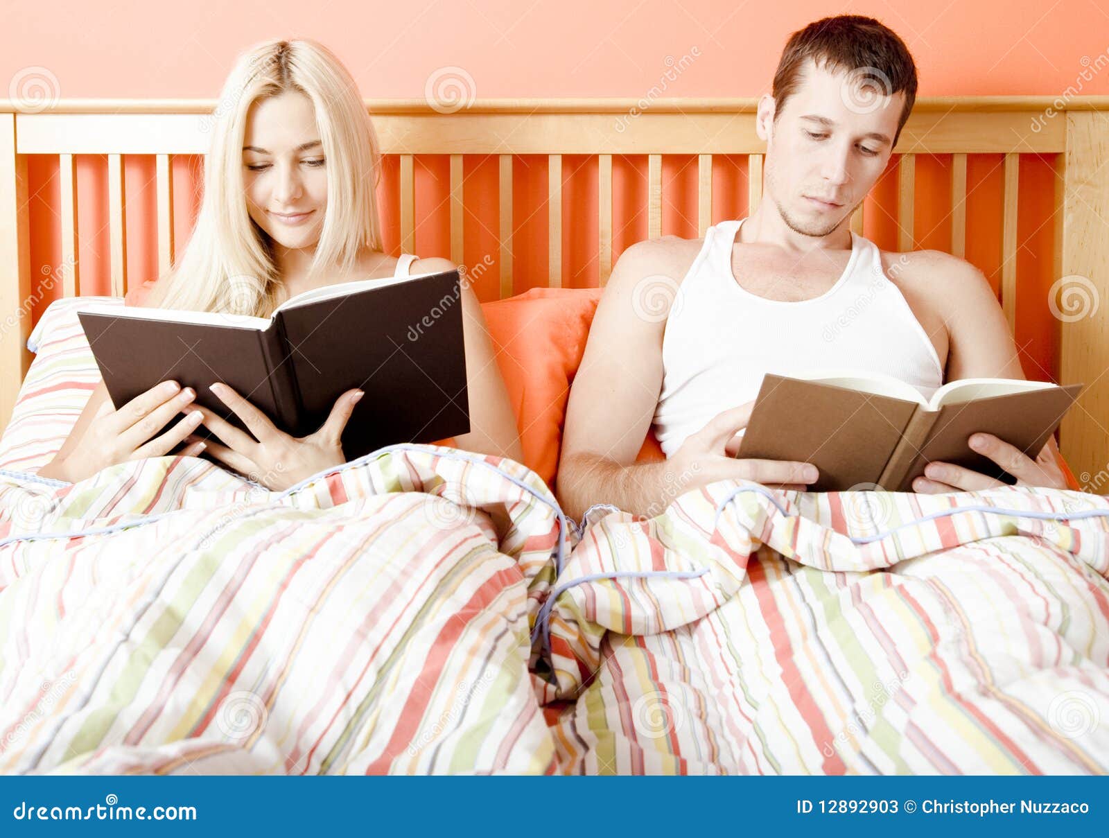 Couple Reading In Bed Stock Image Image Of Enjoyment 12892903