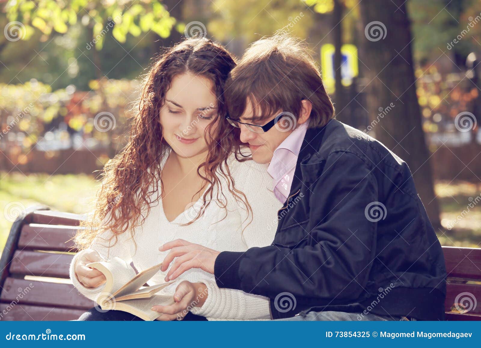 Couple reading book stock image. Image of boyfriend, together - 73854325