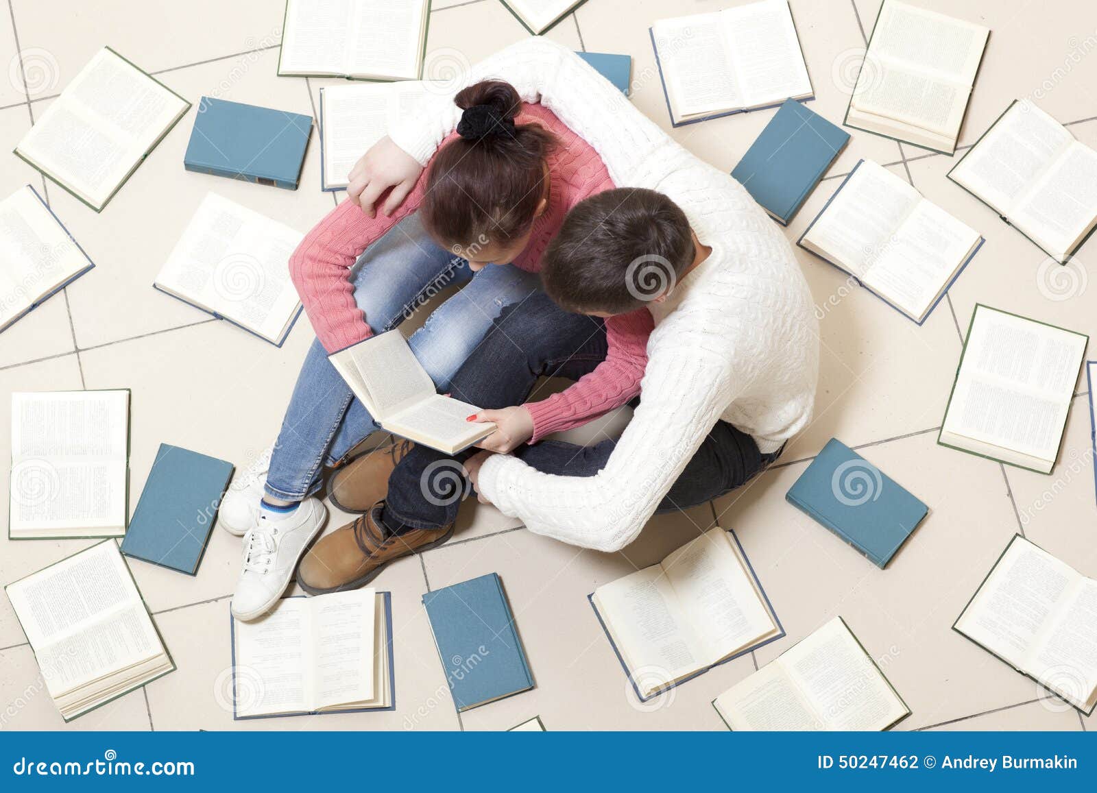 Couple reading a book stock photo. Image of looking, romance - 50247462