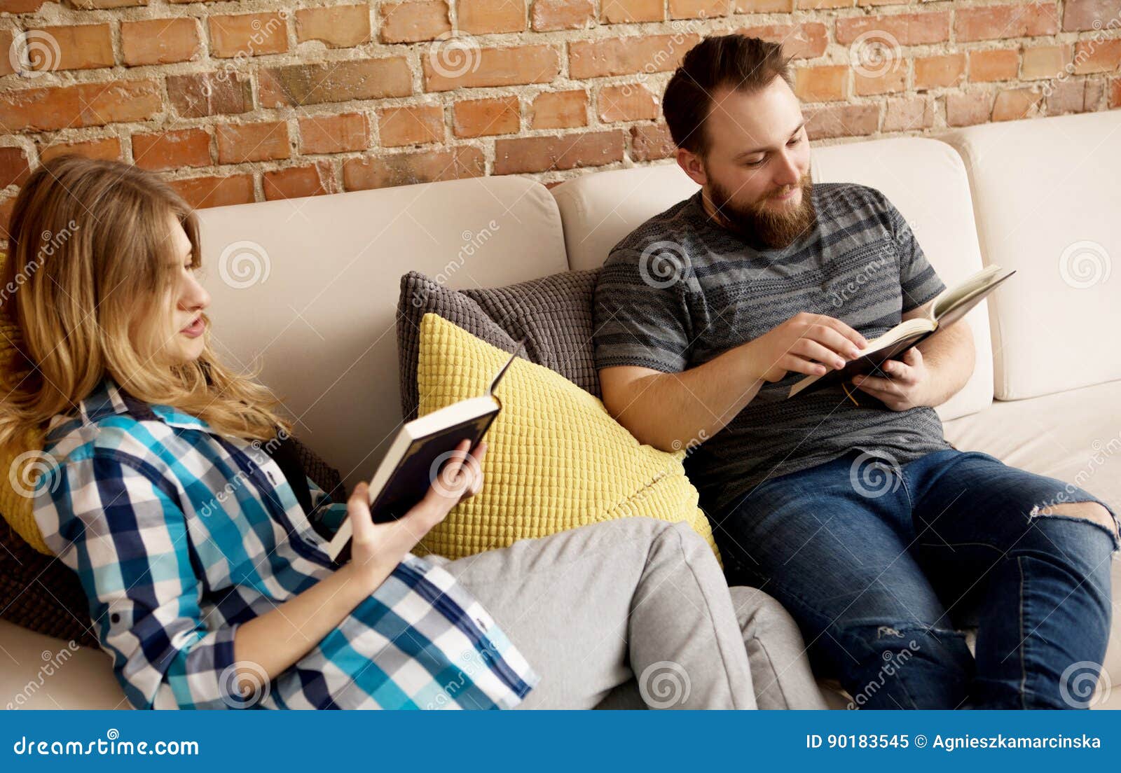 Couple reading books. stock image. Image of lying, leisure - 90183545