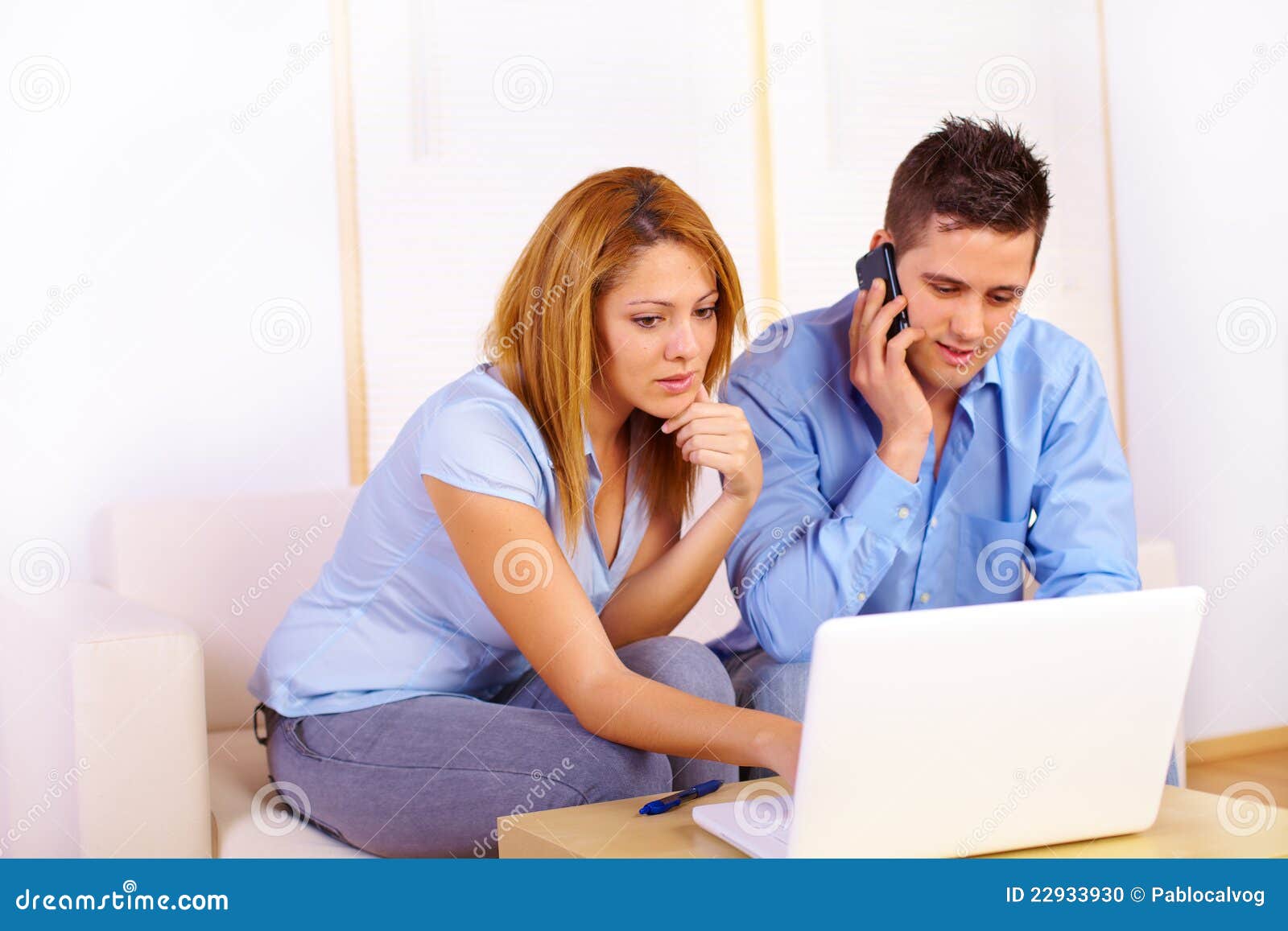 Couple reading documents stock photo. Image of home, blonde - 22933930