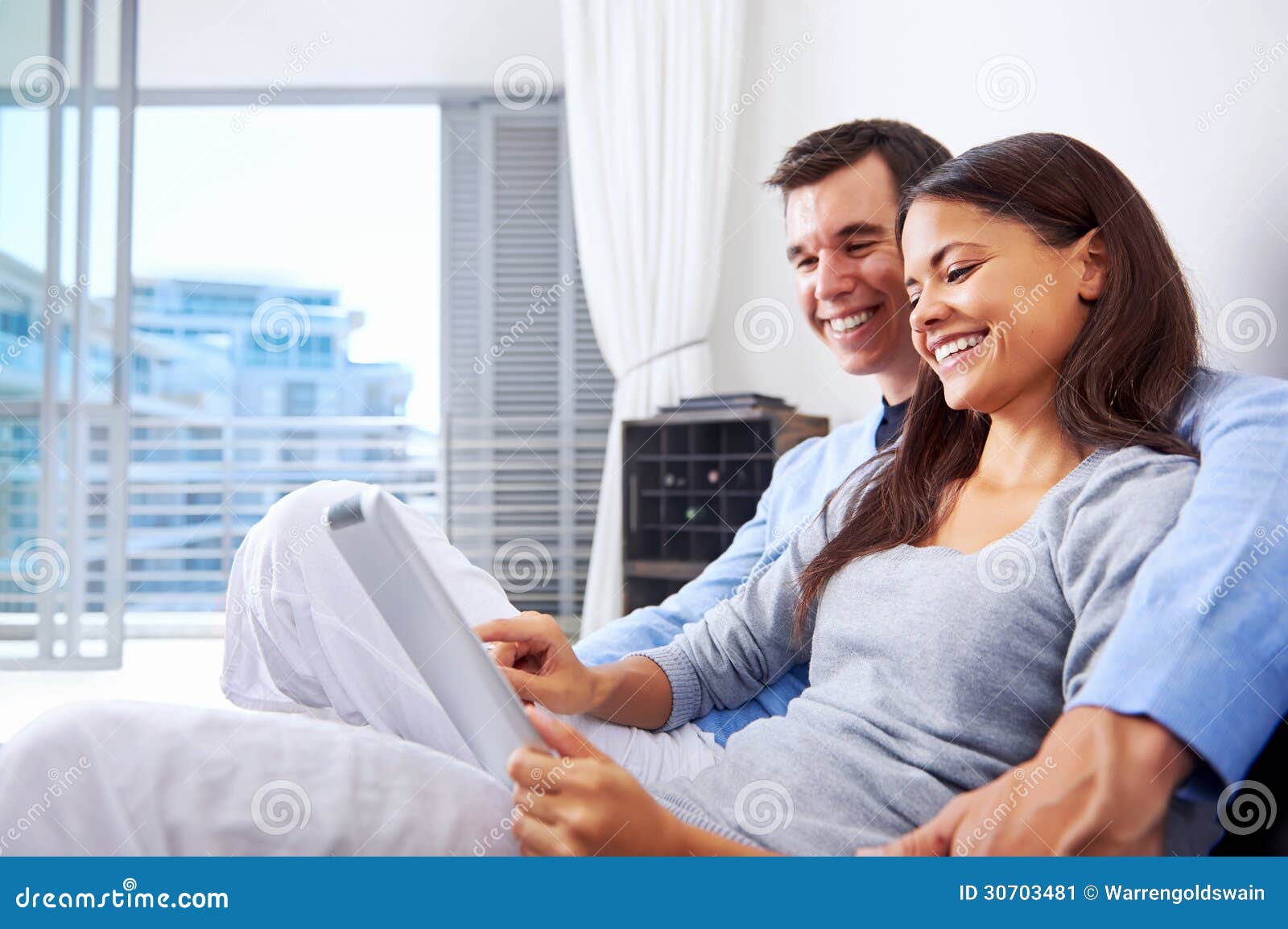 Couple reading at home stock image. Image of caucasian - 30703481