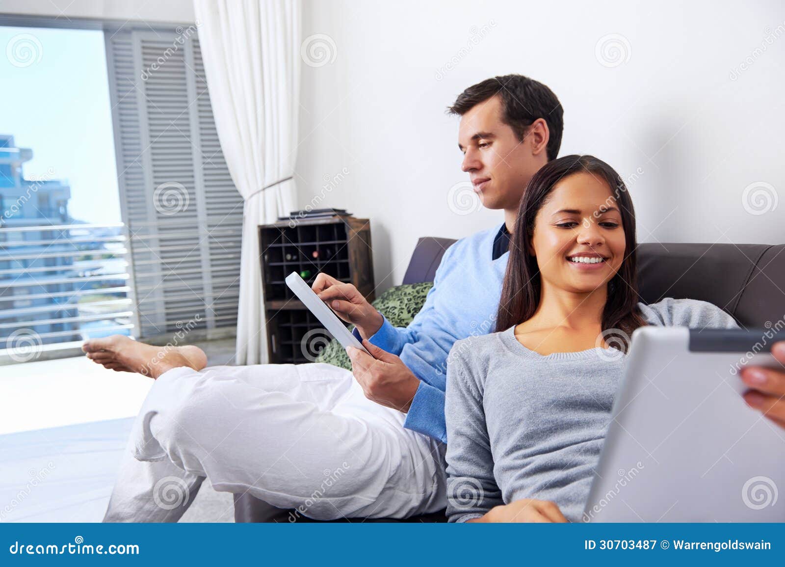Couple reading at home stock image. Image of holding - 30703487