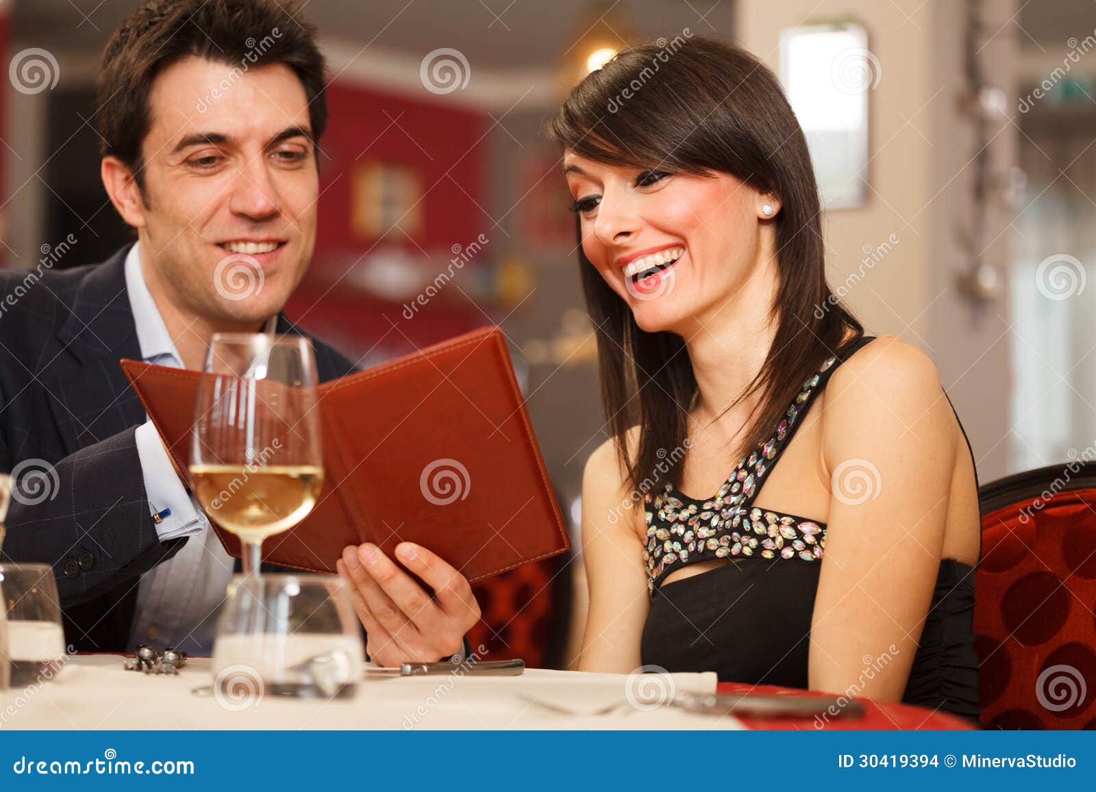 Couple reading the menu stock photo. Image of choosing - 30419394