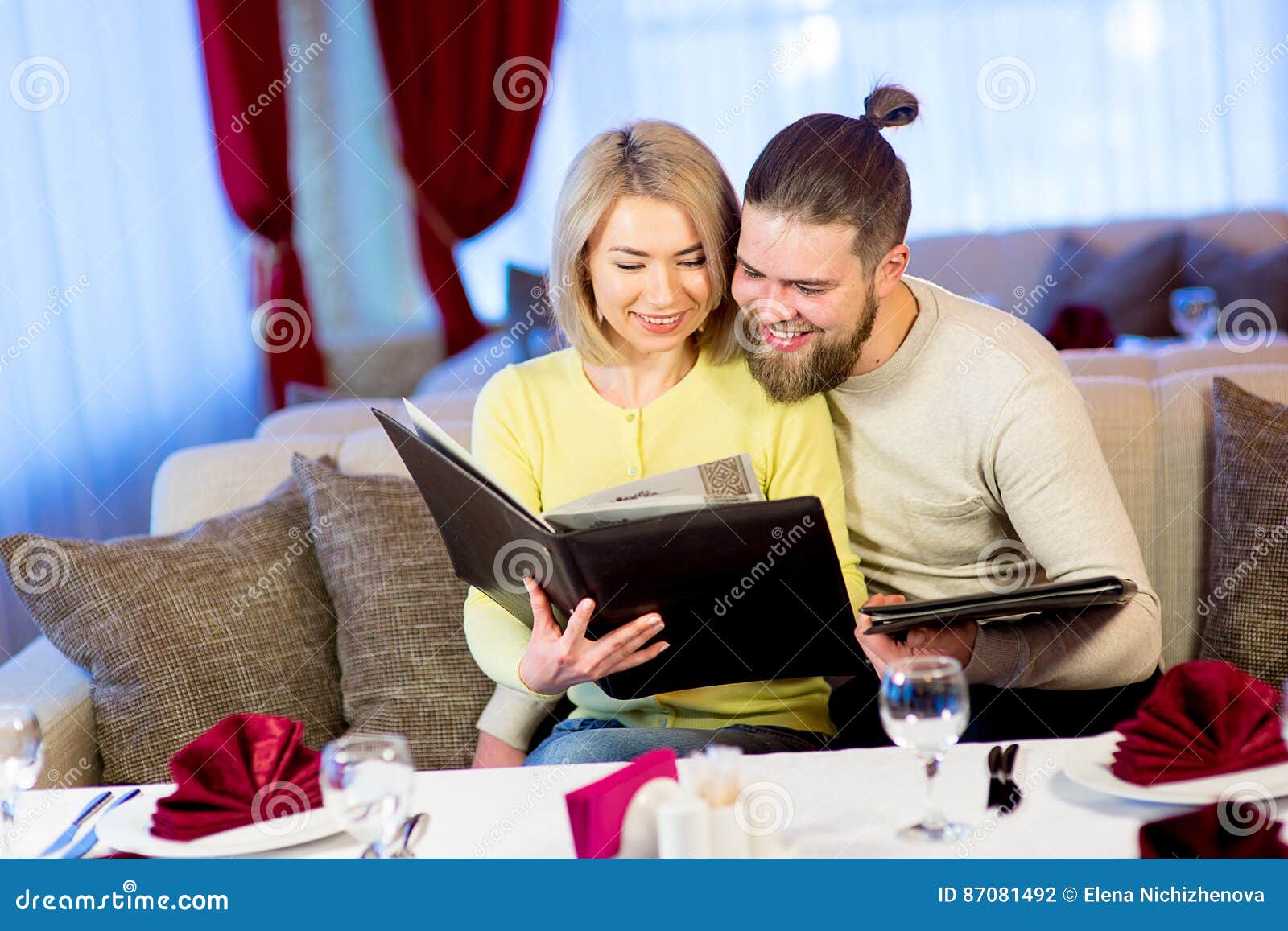 Couple Reading a Menu in a Restaurant Stock Photo - Image of people ...