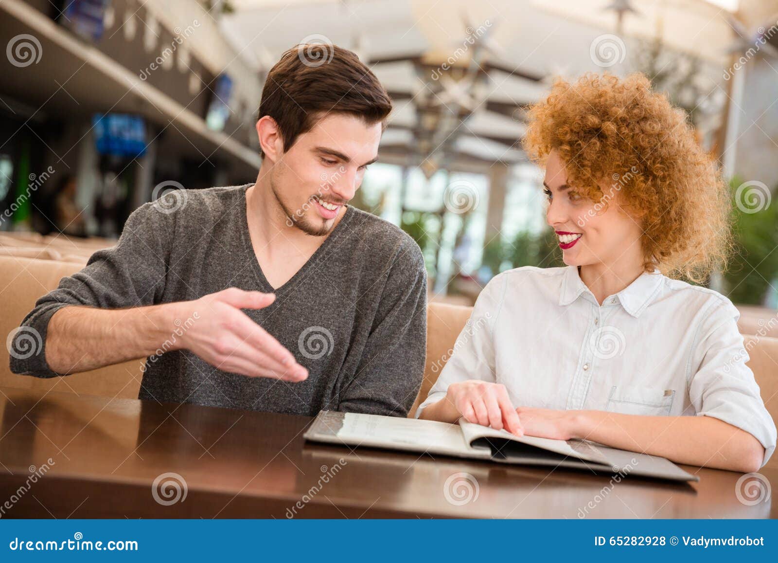 Couple Reading Menu in Restaurant Stock Photo - Image of dinner ...