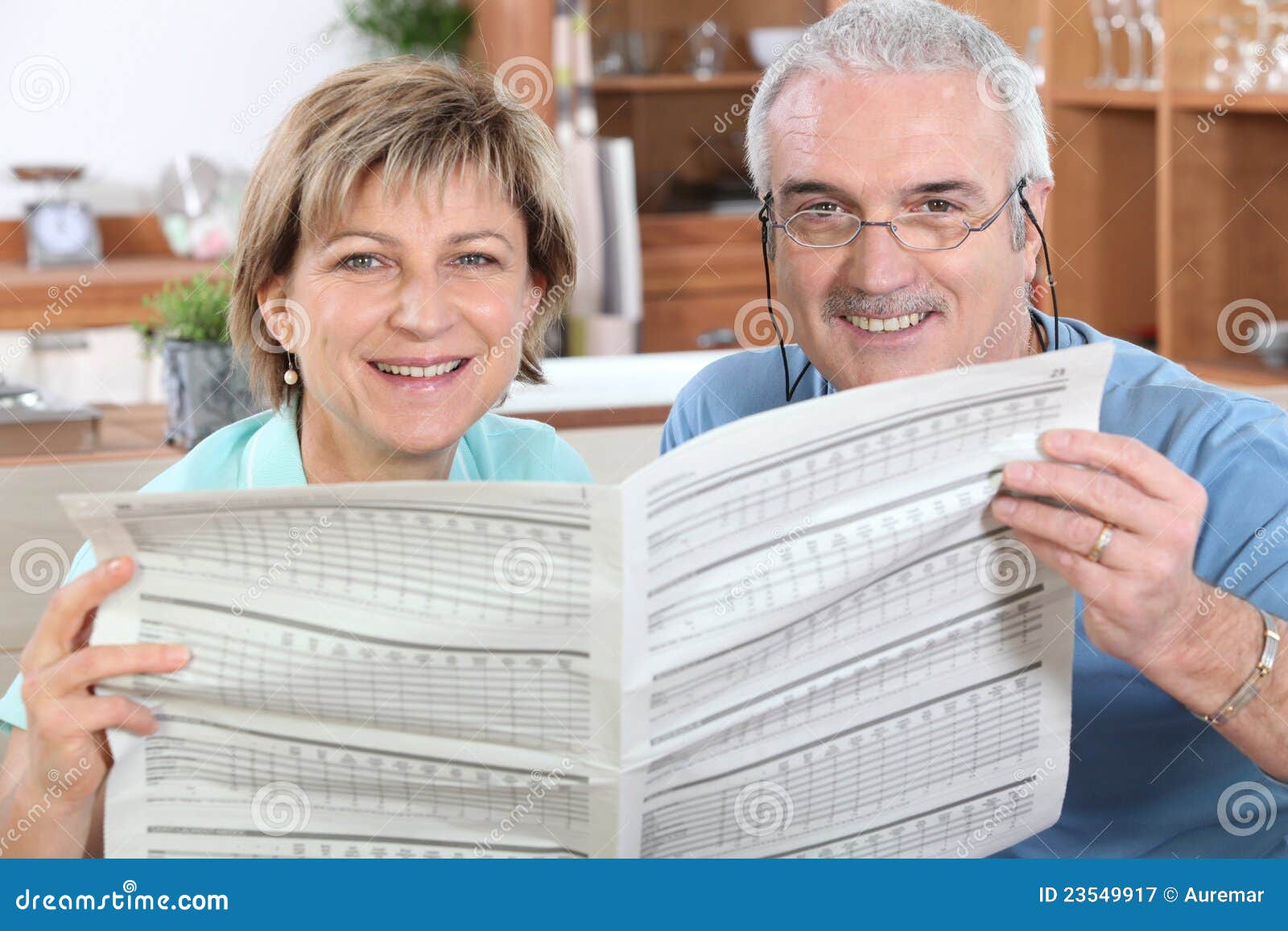 Couple reading a newspaper stock image. Image of caucasian - 23549917
