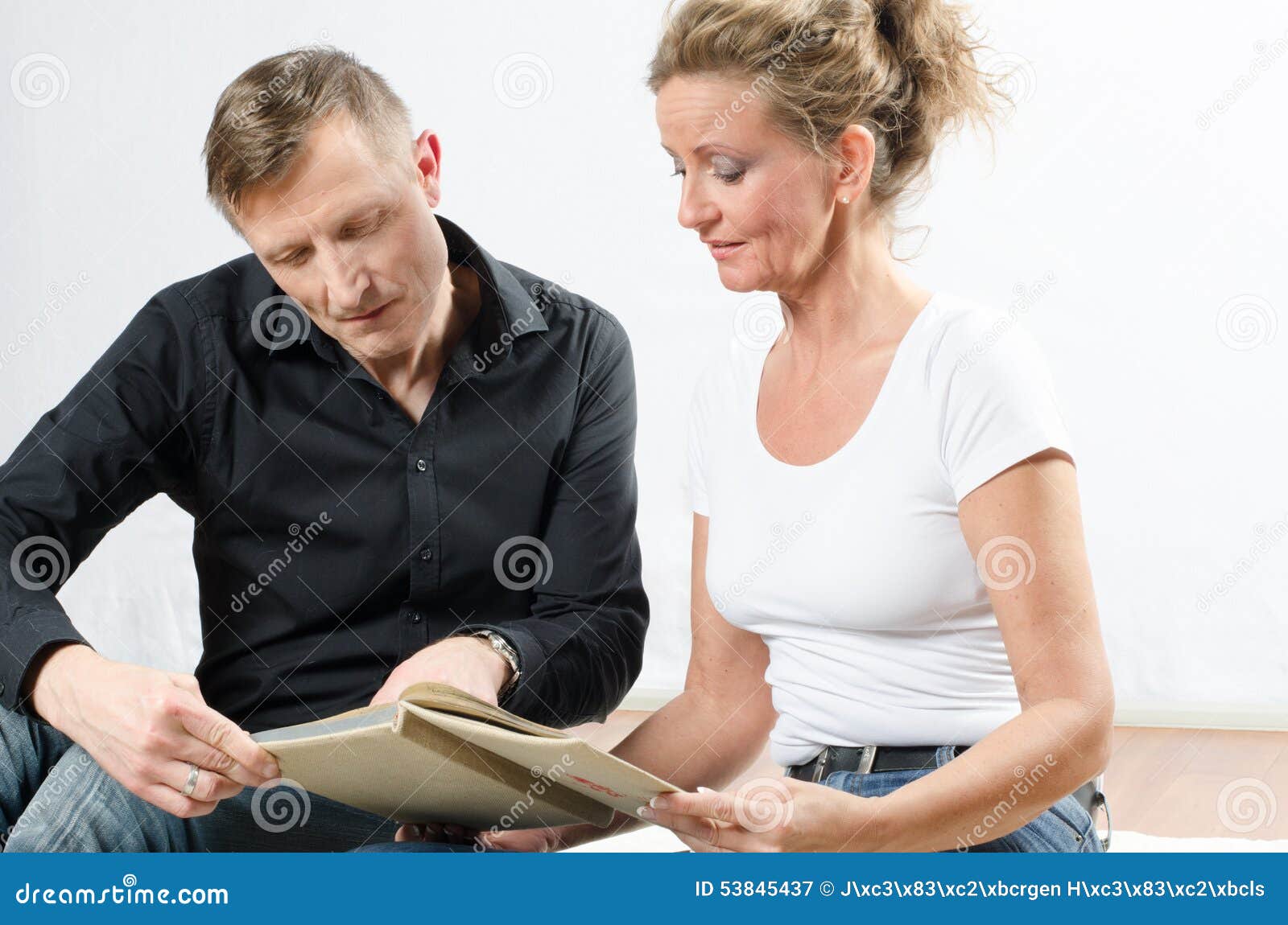 Couple Reading Together in a Book Stock Image - Image of smile, love ...