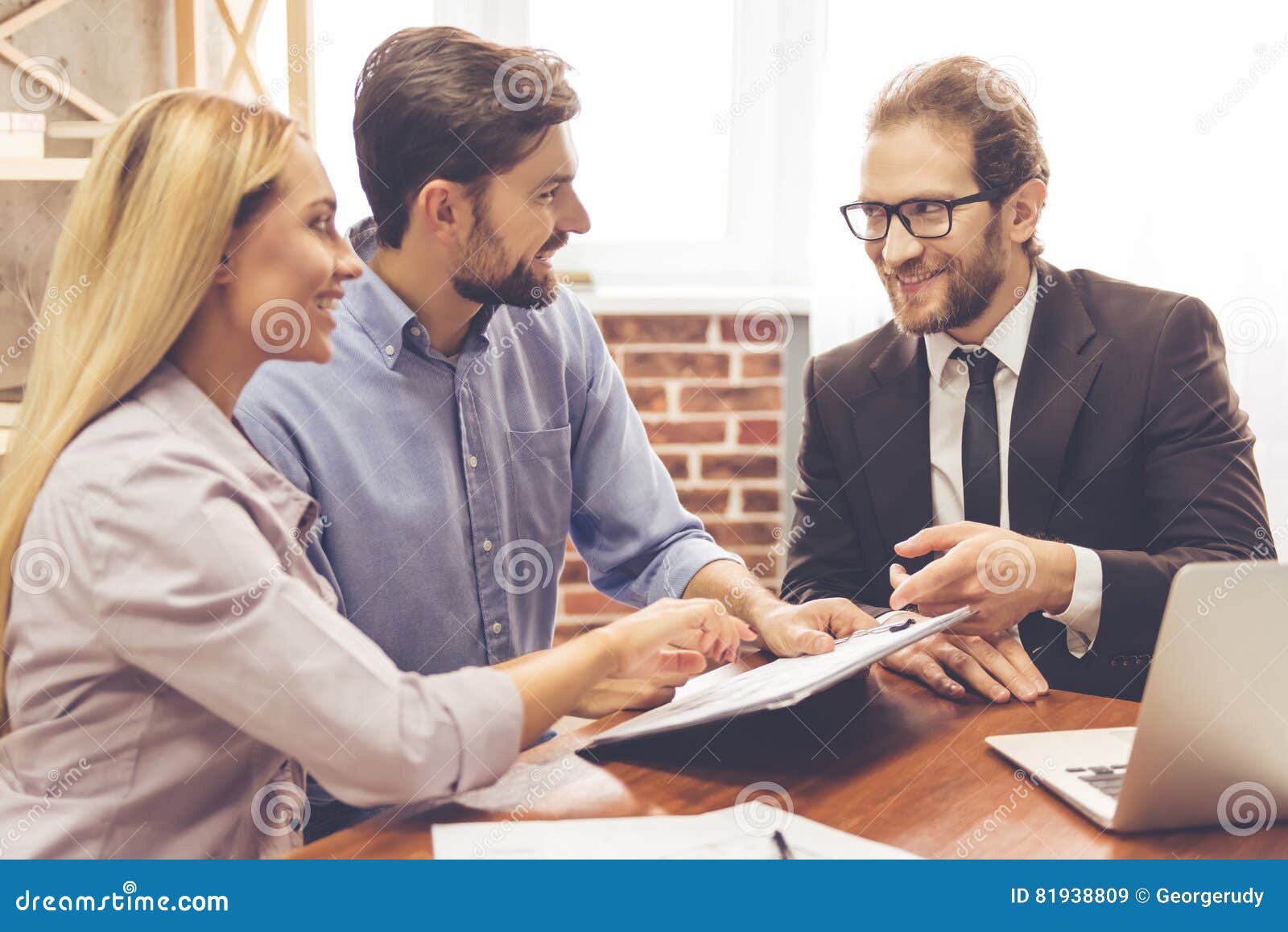 Couple and a realtor stock image. Image of company, management - 81938809